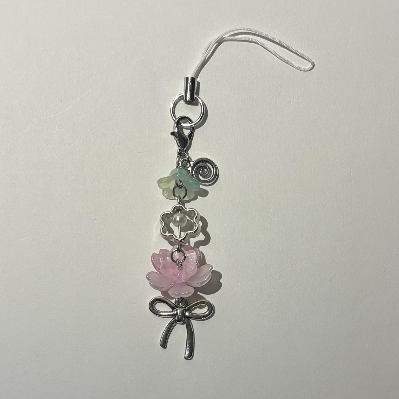 flower phone charm ‧₊˚ ༉‧₊˚. phone charm made with... - Depop