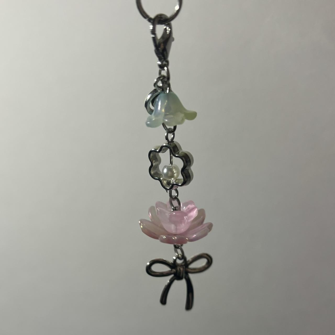 flower phone charm ‧₊˚ ༉‧₊˚. phone charm made with... - Depop