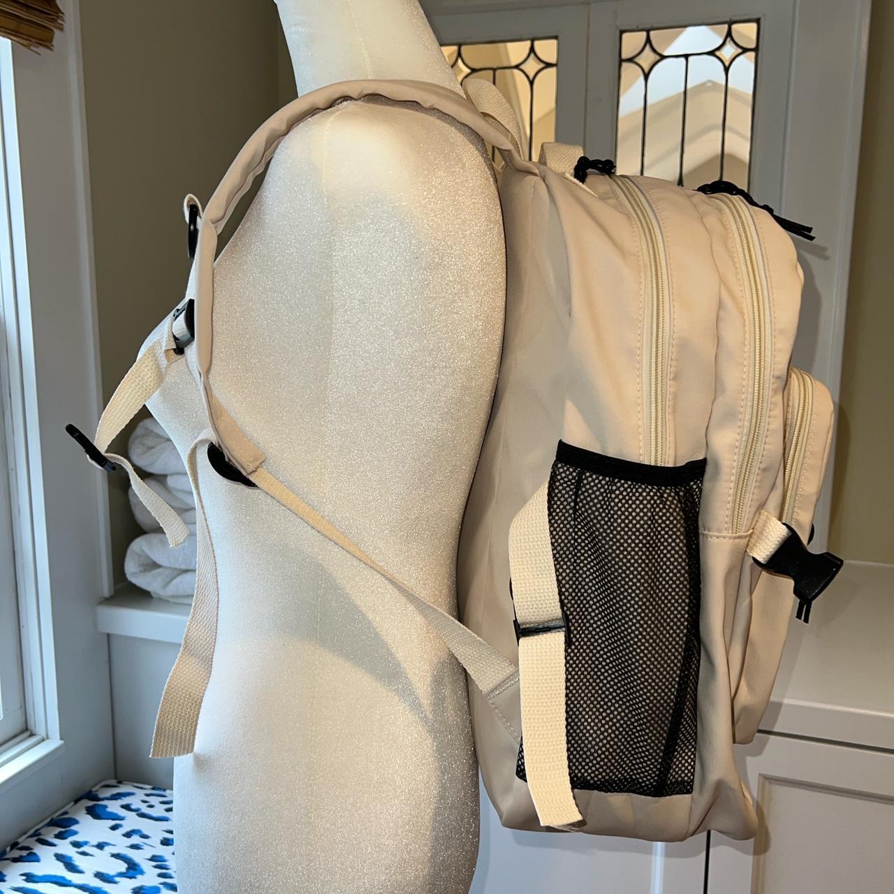 MRMI cream color backpack with black trim detail.... - Depop