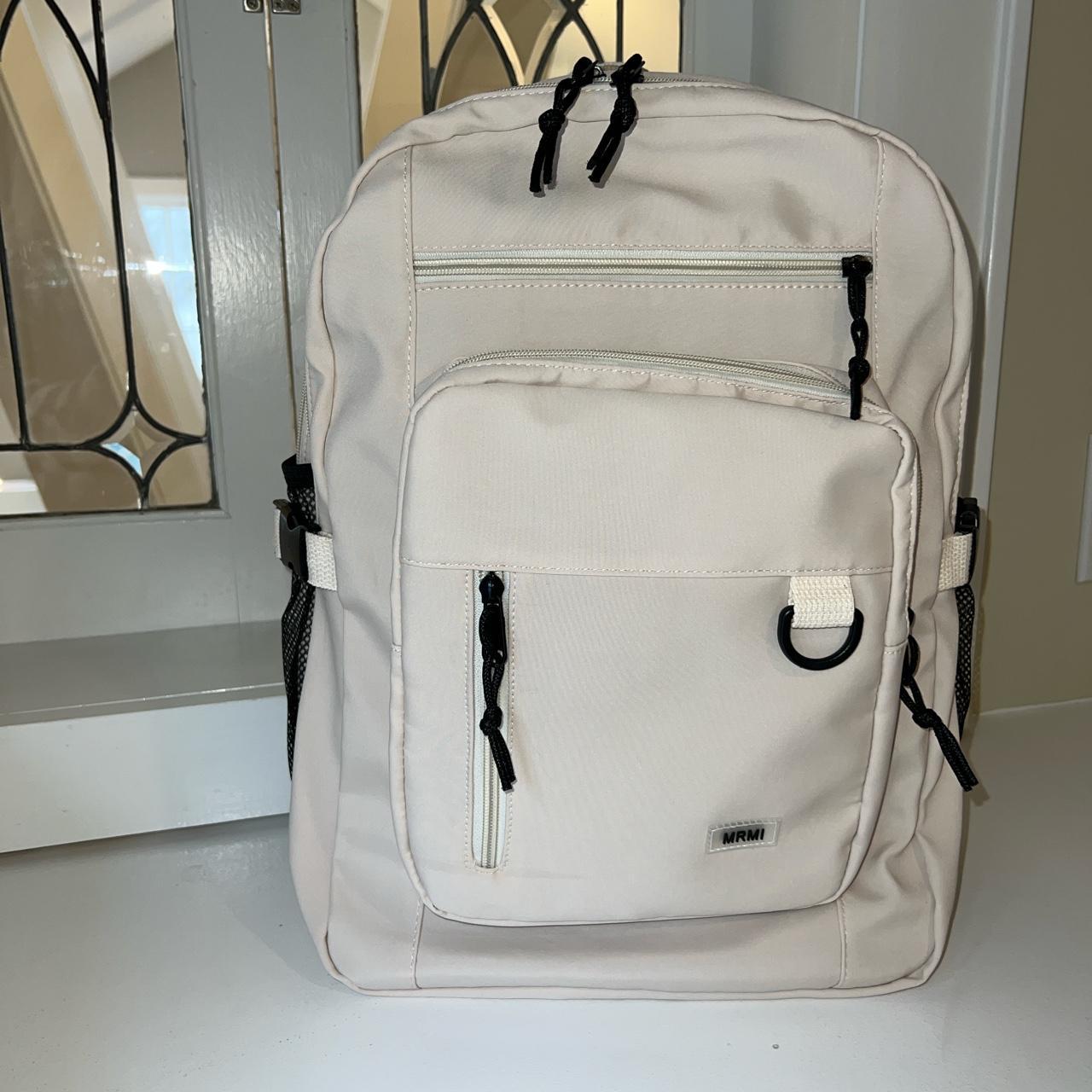 MRMI cream color backpack with black trim detail.... - Depop