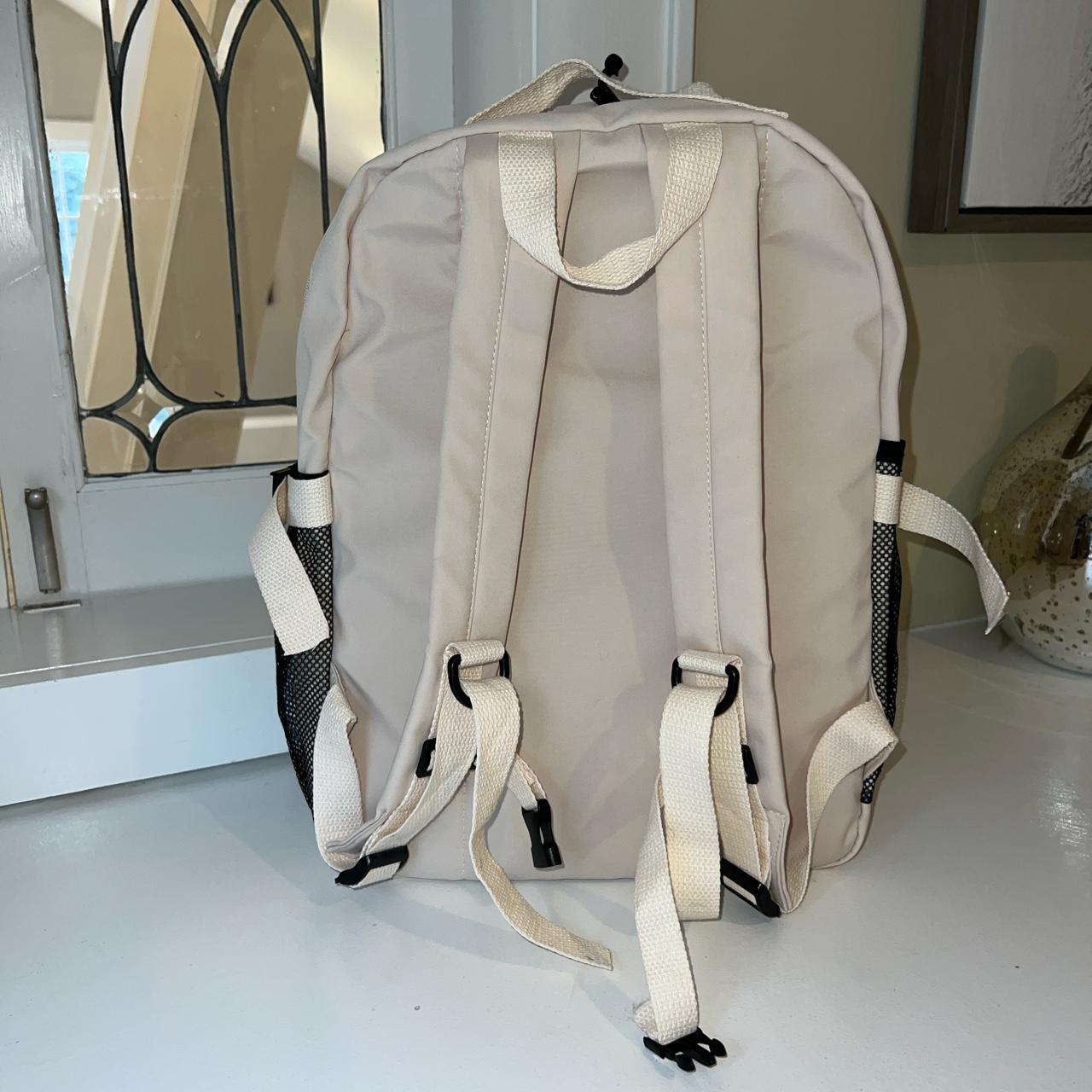 MRMI cream color backpack with black trim detail.... - Depop