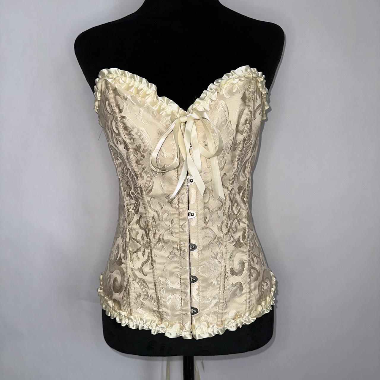 White and cream corset with lace up front and ruffle... - Depop