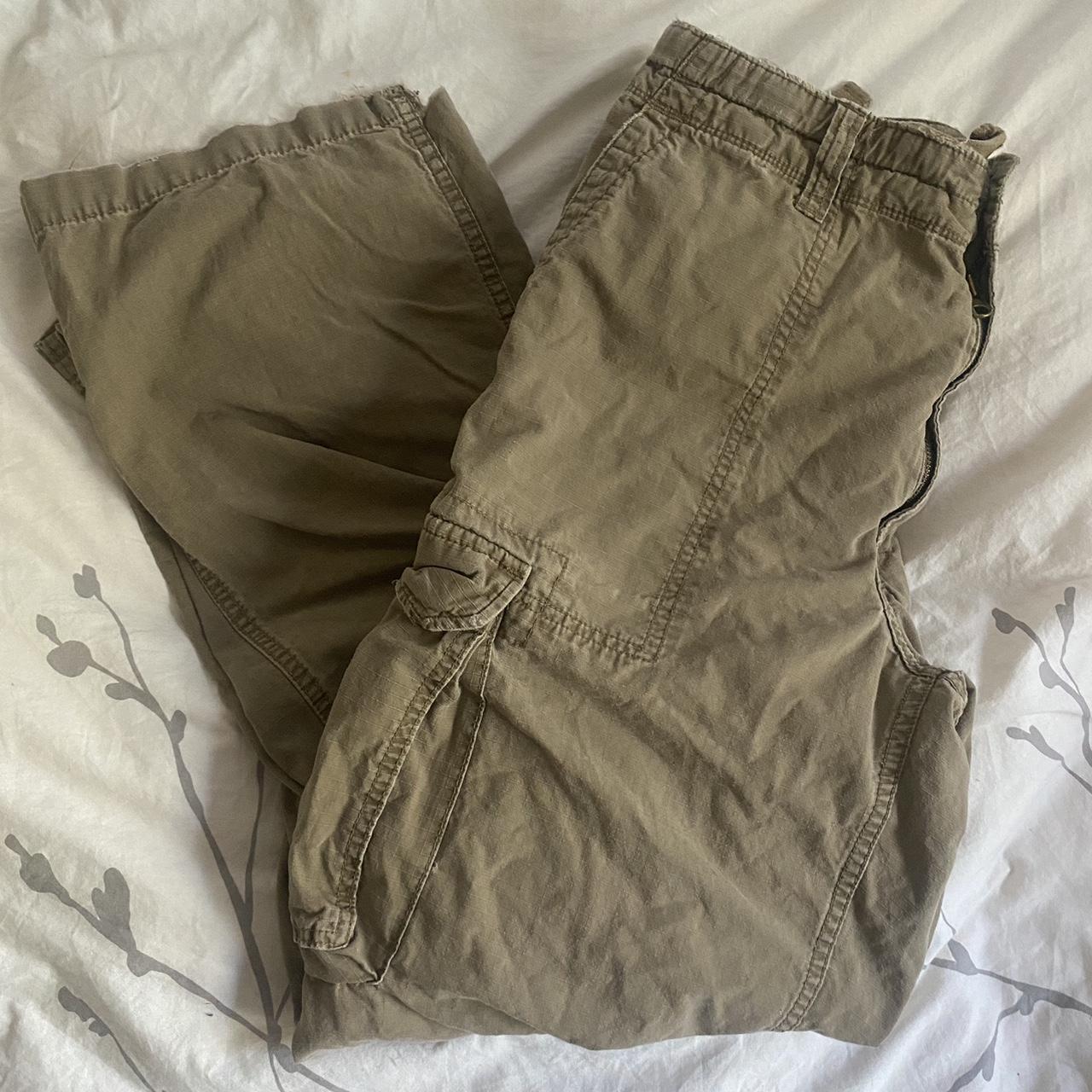 Tan cargo pants with a baggy fit. Adjustable... - Depop