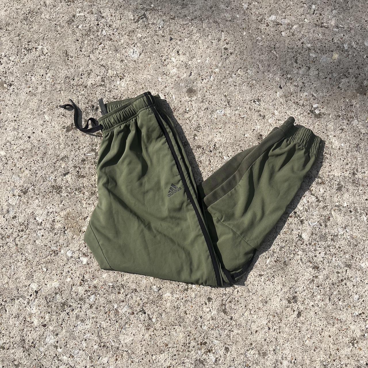 Adidas olive green track pants stripes down the leg... - Depop