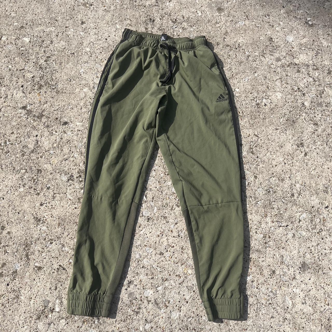 Adidas olive green track pants stripes down the leg... - Depop