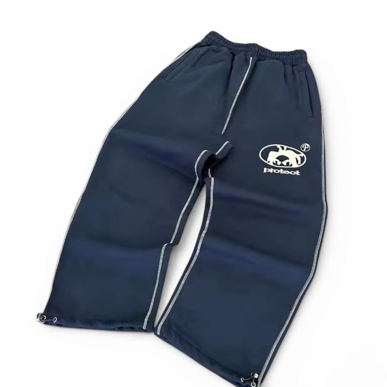 Navy and Beige Protect high-waisted sweatpants with... | Depop