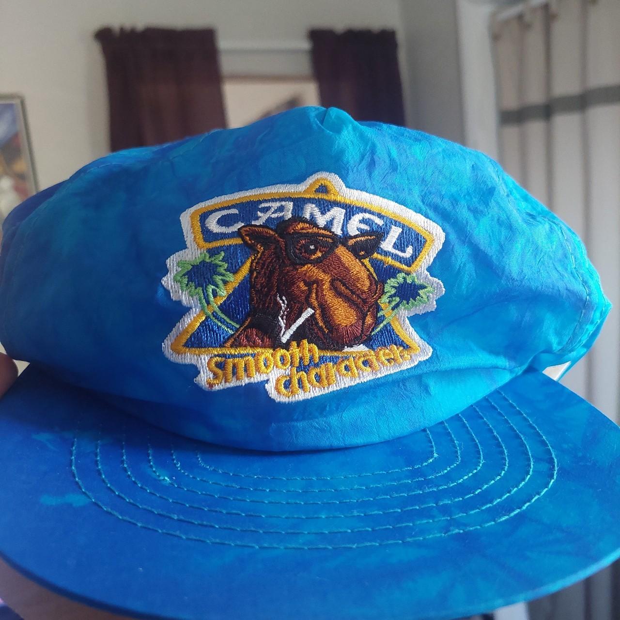 This vintage blue snapback cap features the iconic... - Depop