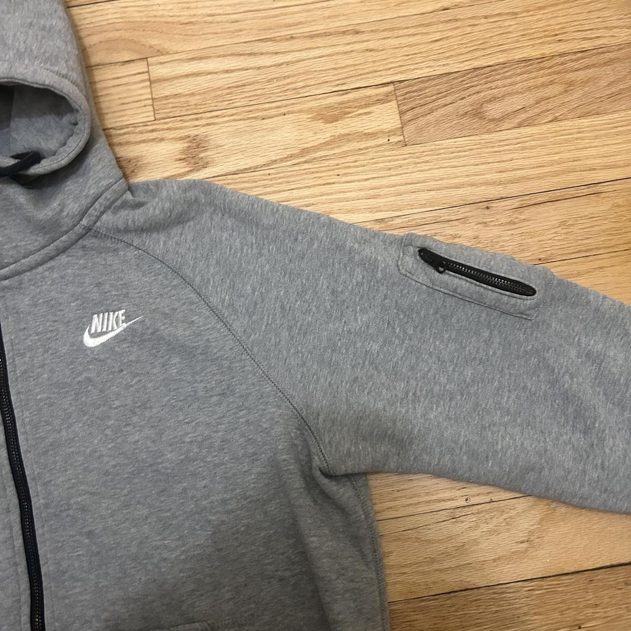 Grey nike zipup hoodie with zipper on the arm paint... - Depop