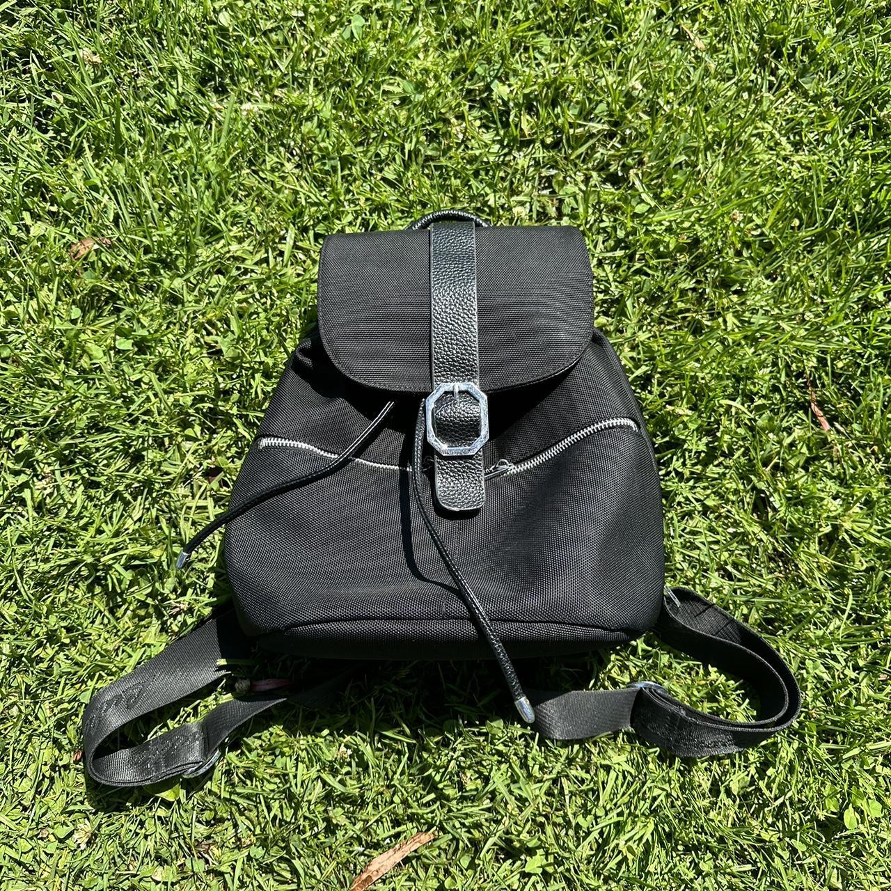 Super cute black mini backpack with silver details... - Depop