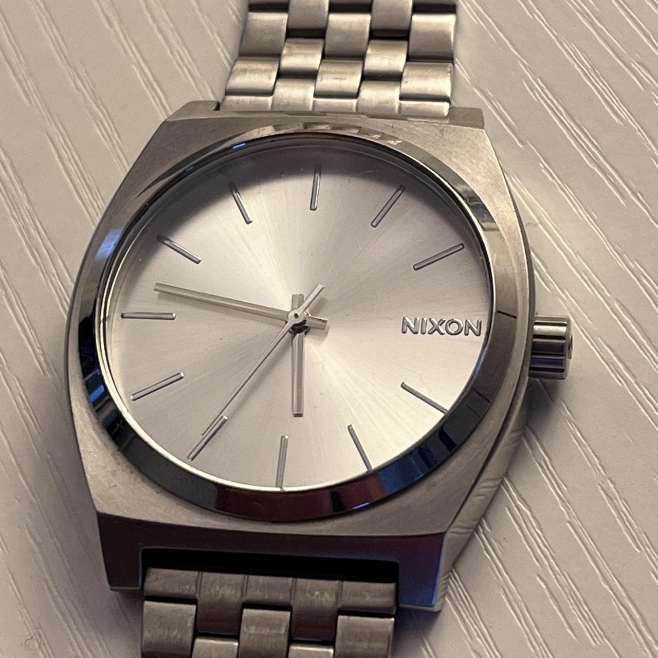 Sleek silver Nixon watch with a modern skinny fit - Depop