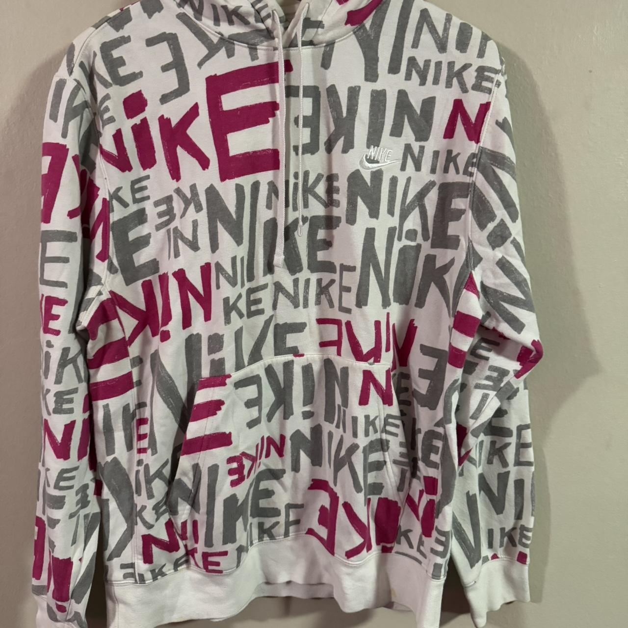 Medium pink and white Nike all over logo print... - Depop
