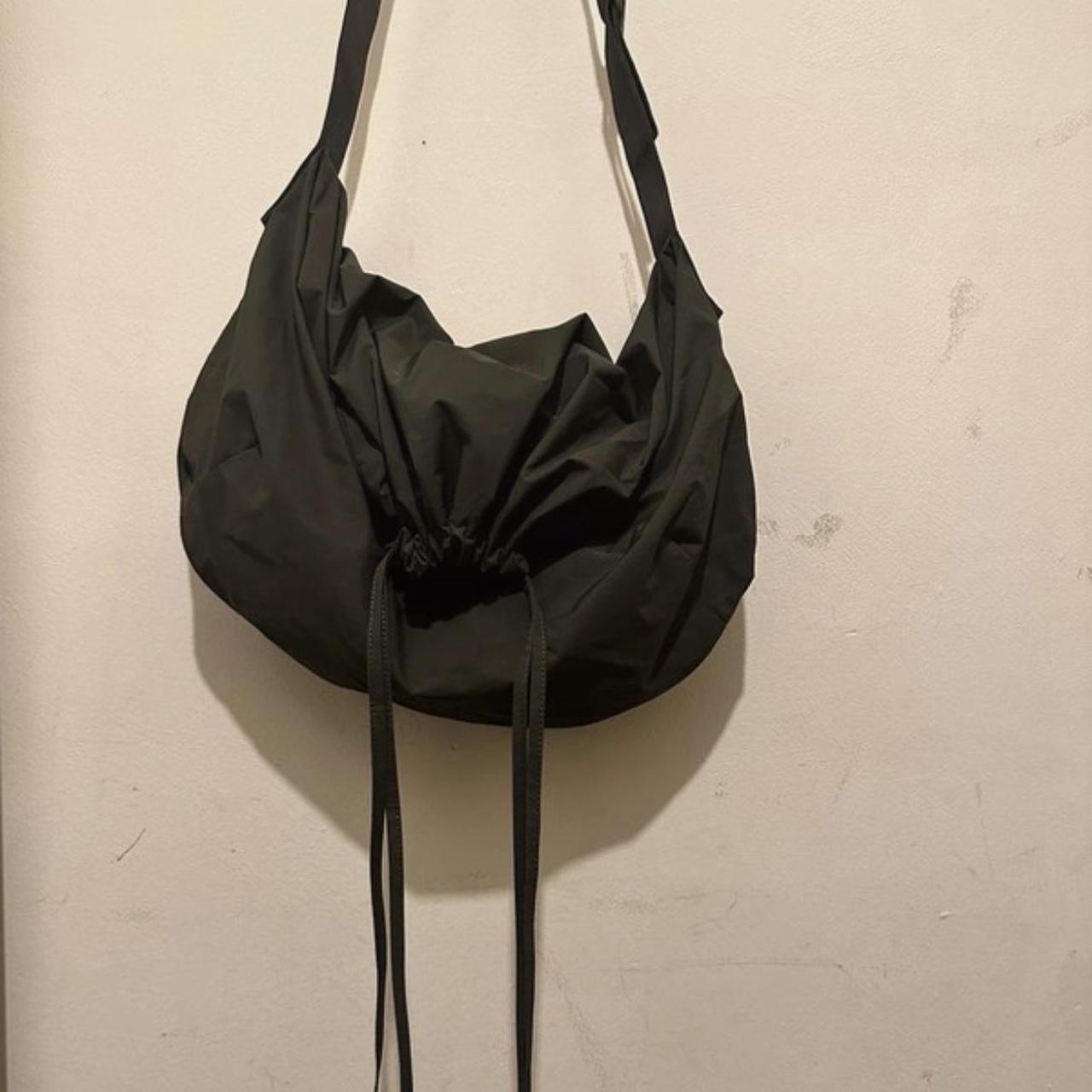 Uniqlo Drawstring Crossbody Bag in Dark green - Depop