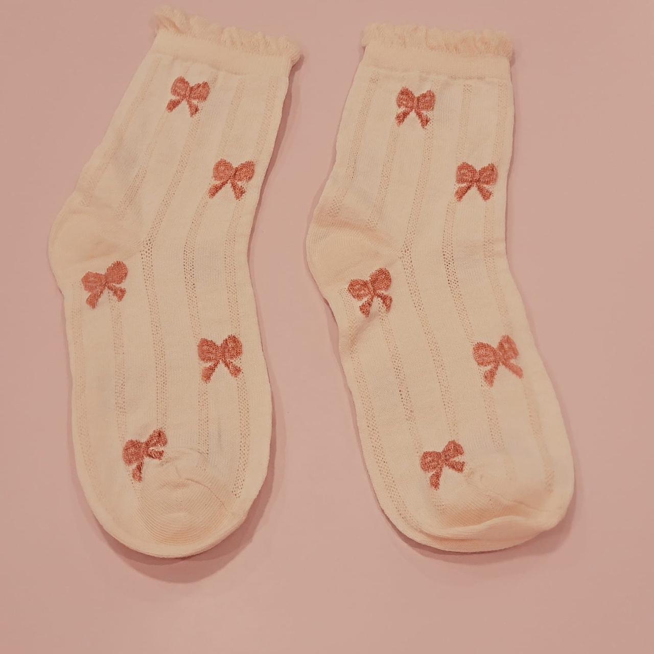 cream colored socks with pink bows - Depop