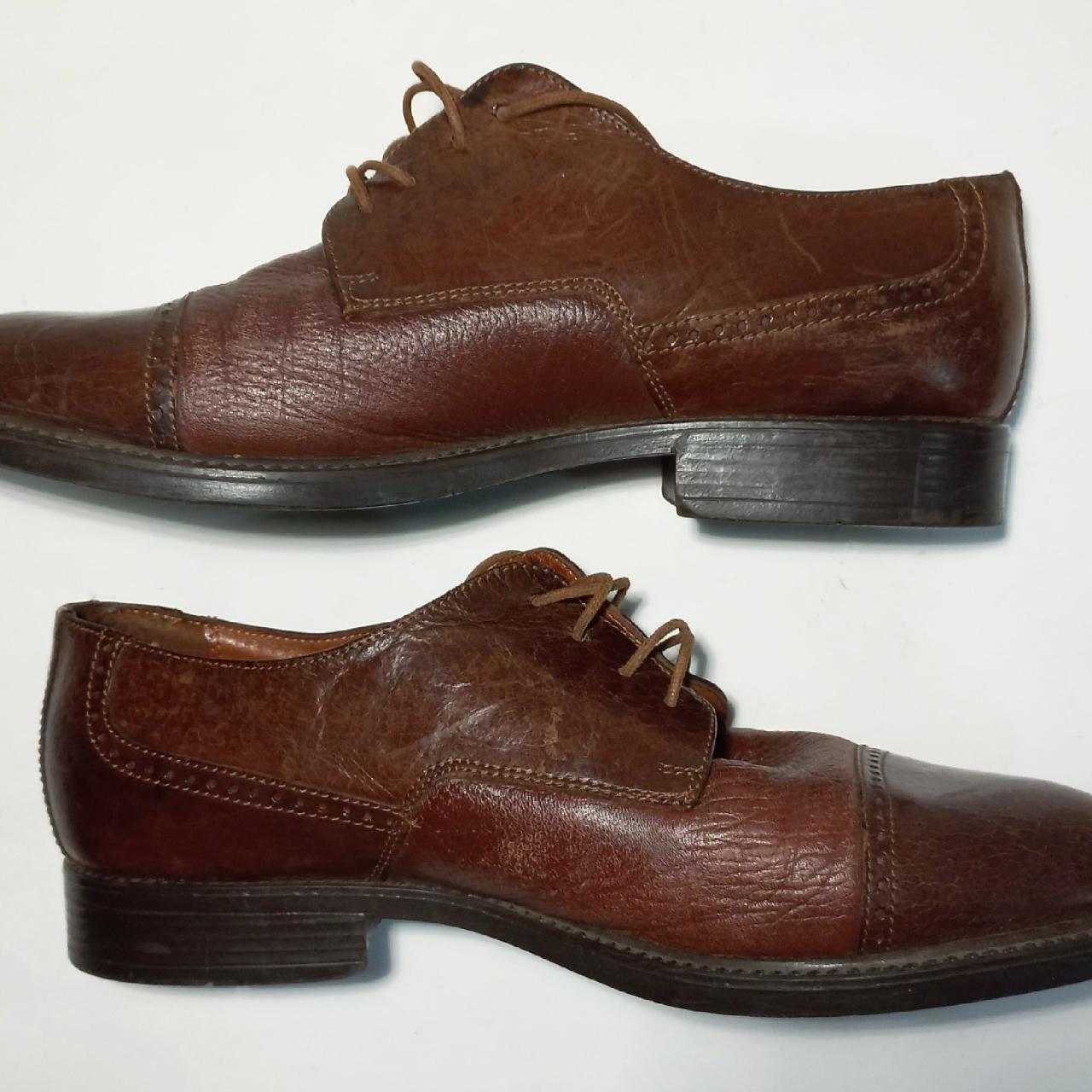 One shoe shows traces of glue repair, please see... - Depop