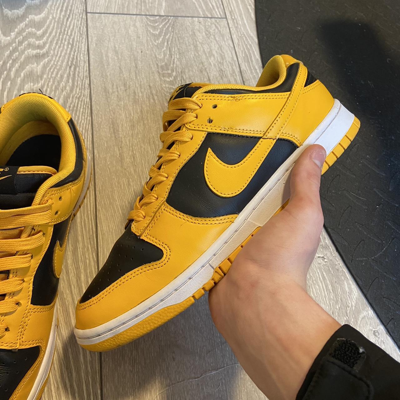 University gold and black Nike dunks - Depop