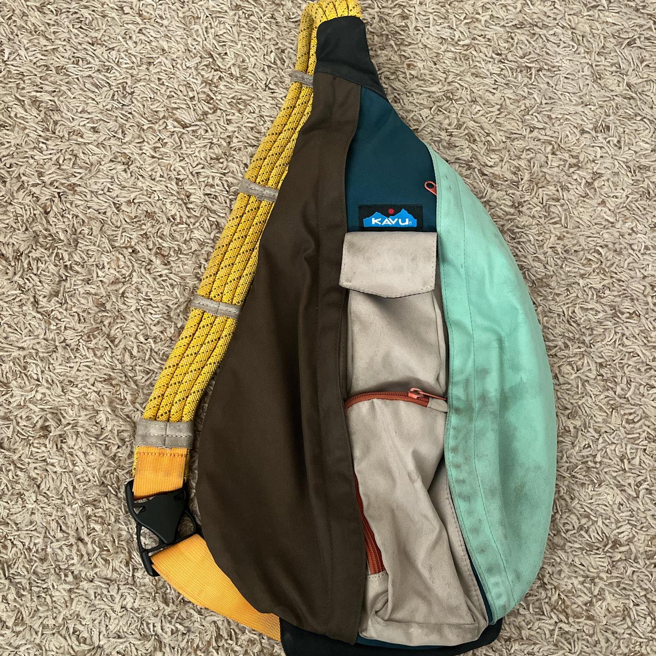 Brown and blue Kavu Sling bag. Has been used and had... - Depop