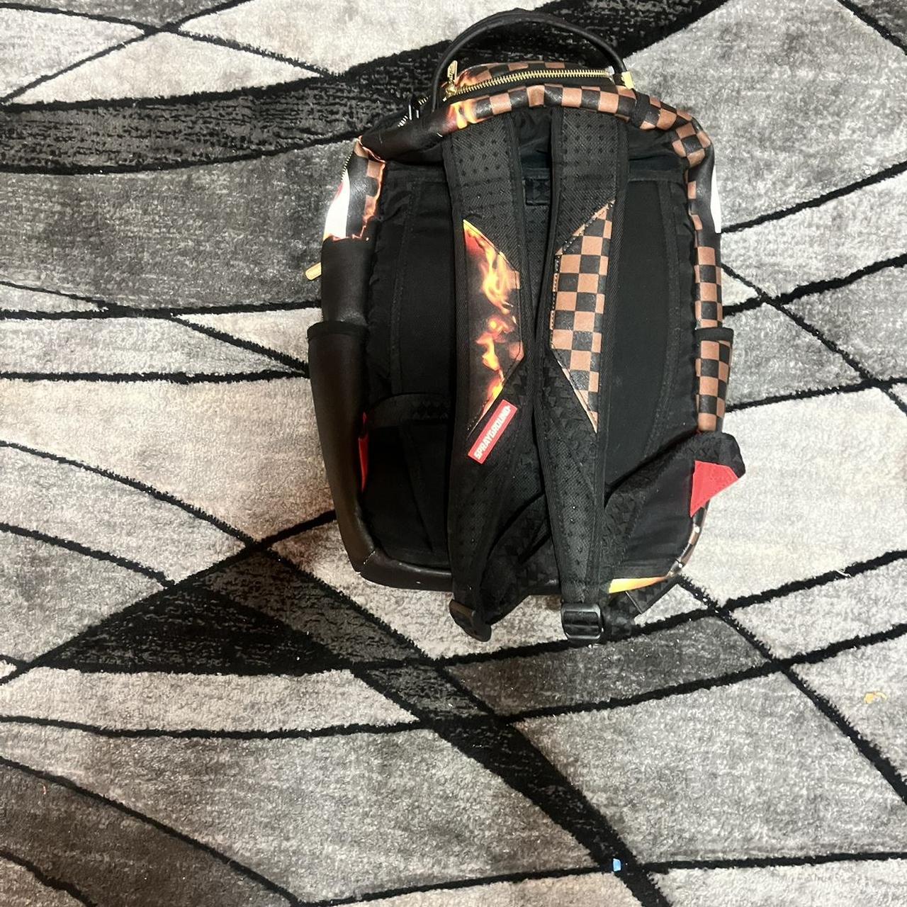 sprayground book bag the book bag does not zip up - Depop