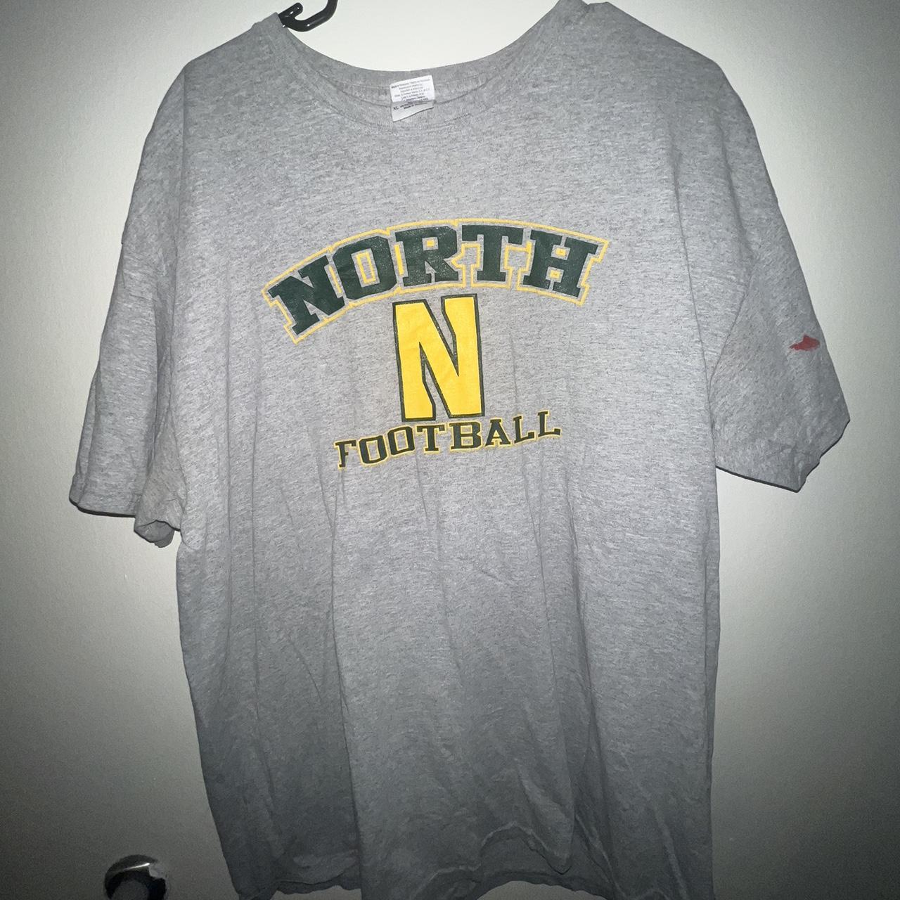 North Football Tshirt. Has a red (I believe) paint... - Depop