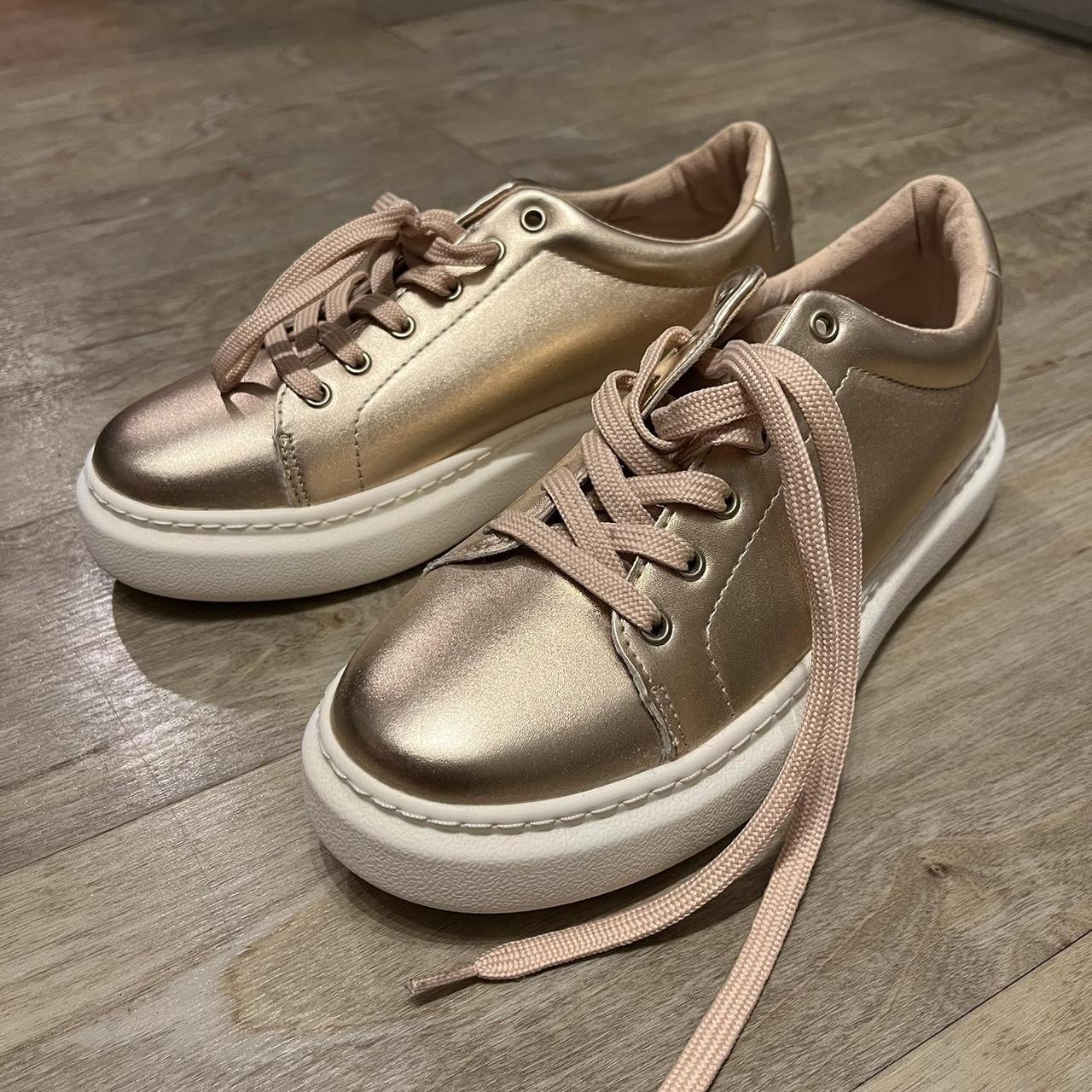 Size 6 ASOS gold trainers - never worn before. Shiny... - Depop