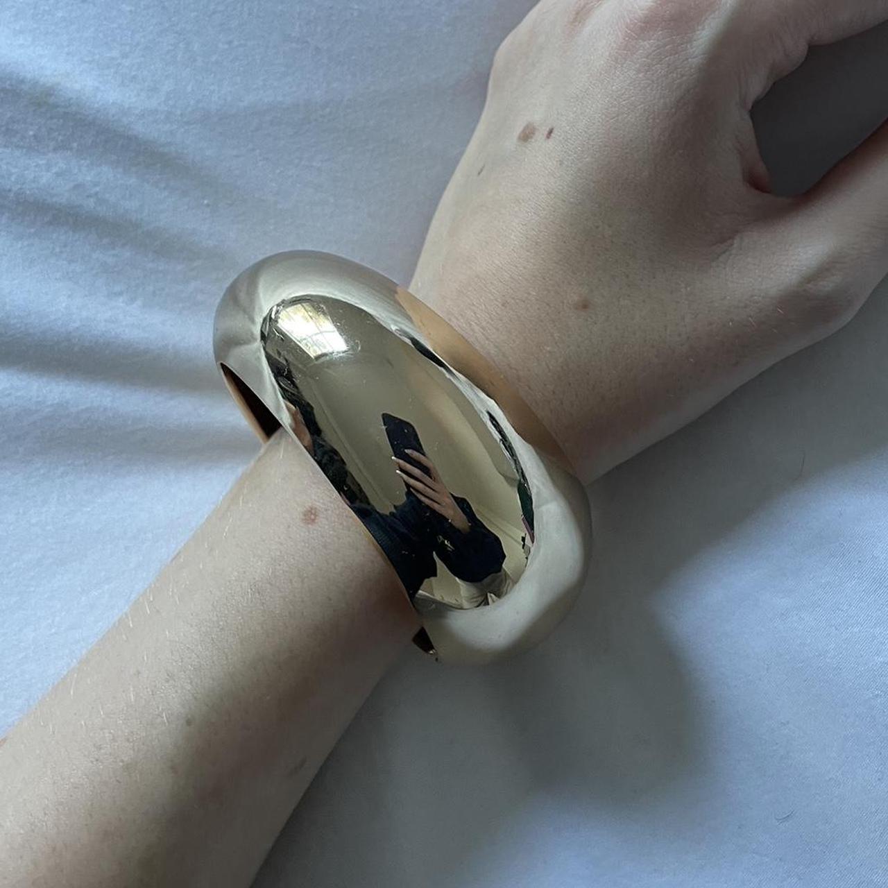Chunky gold bangle, very chic, very... - Depop