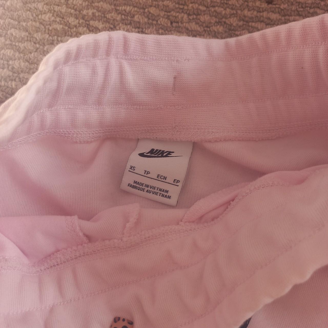 Pink Nike tech pants, never worn bought for 110$ - Depop