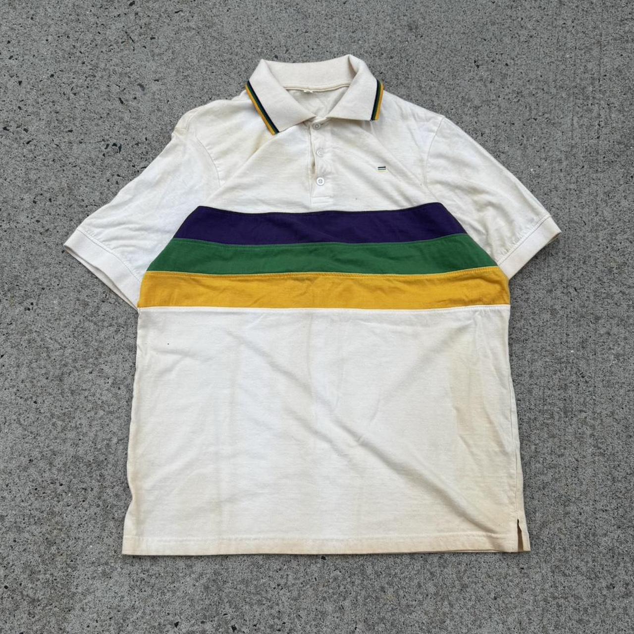 White Lacoste polo shirt with green, blue, and... | Depop