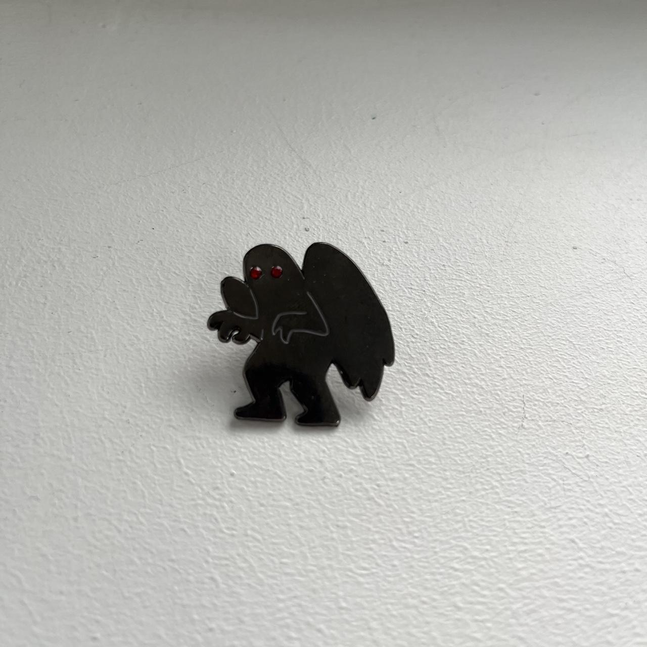 Shiny silver-black Mothman pin with red rhinestone... - Depop
