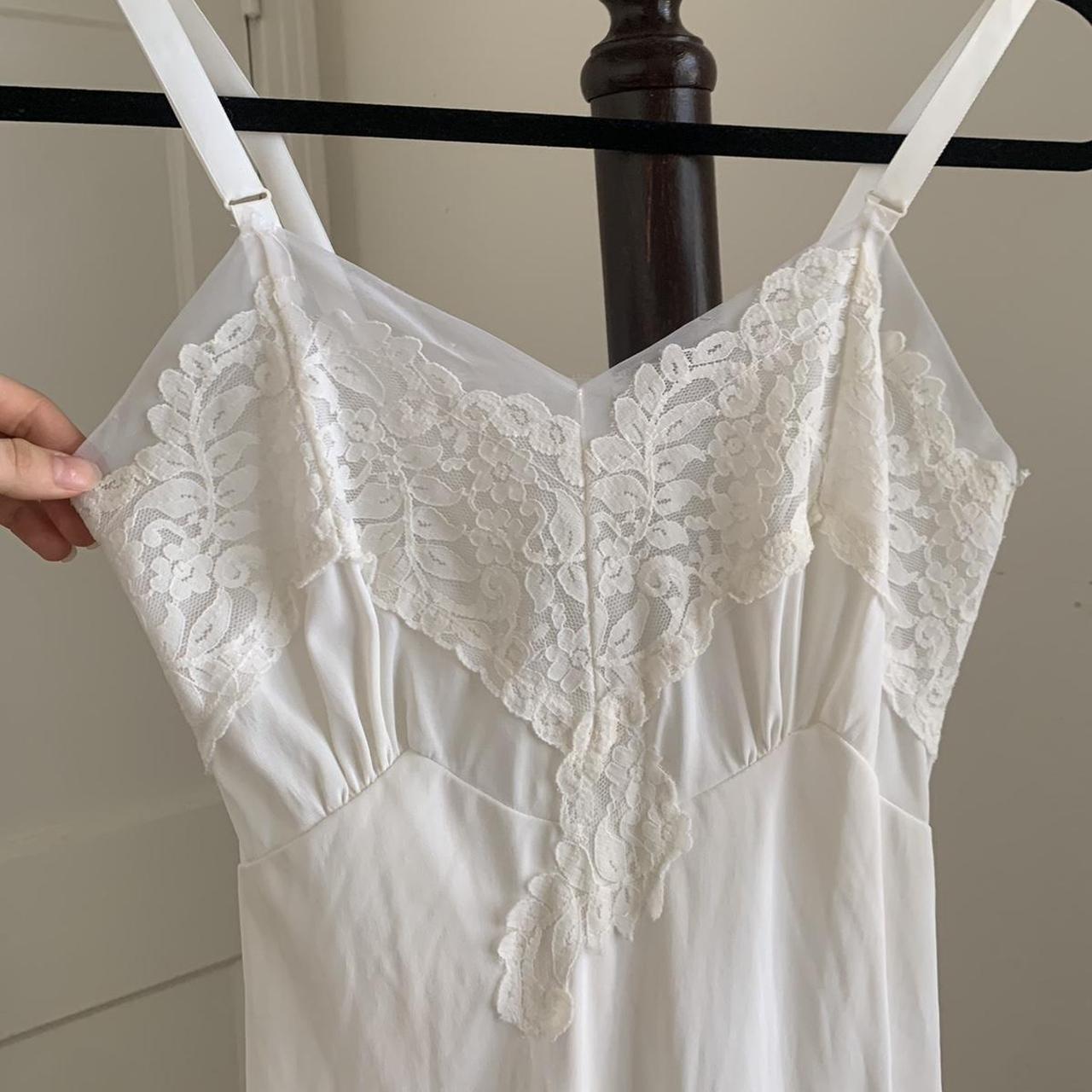 Beautifully fitted slip with lace accents and... - Depop