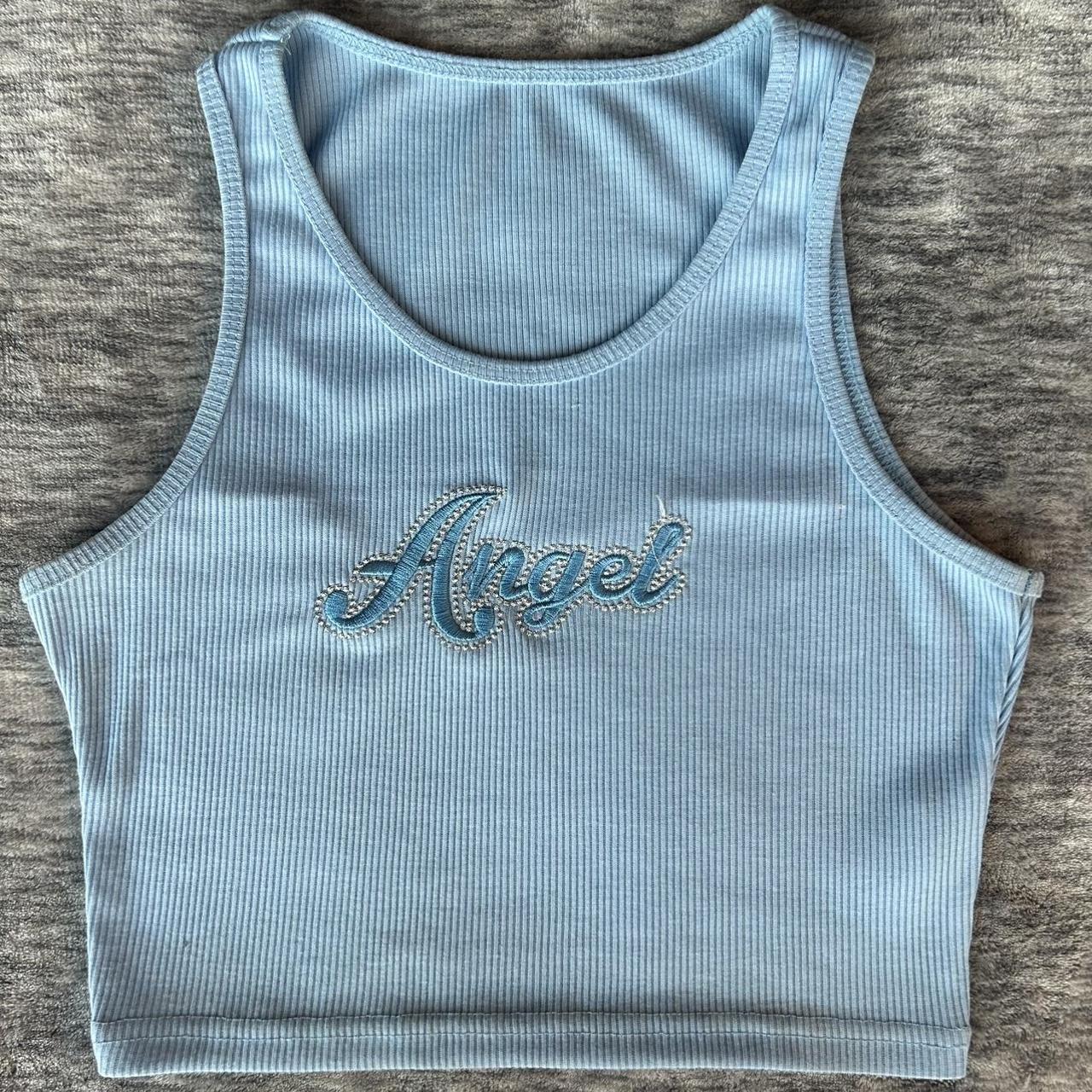 Medium baby blue angel tank top. Slim fit fabric,... - Depop