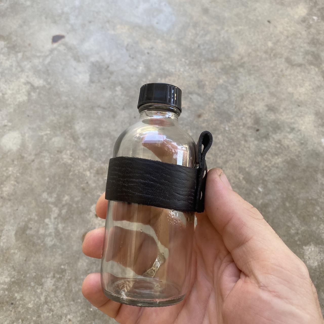 Hand sewn black leather wrapped bottle in horse napp... | Depop