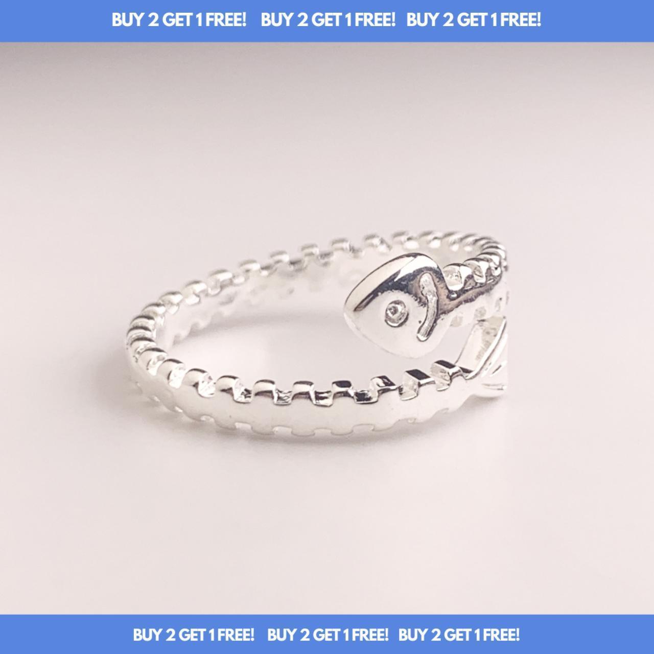 Silver Fish ring Is adjustable to fit any finger... - Depop