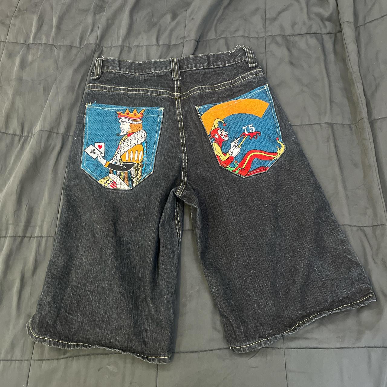 Long, baggy black jorts with custom design on back... | Depop