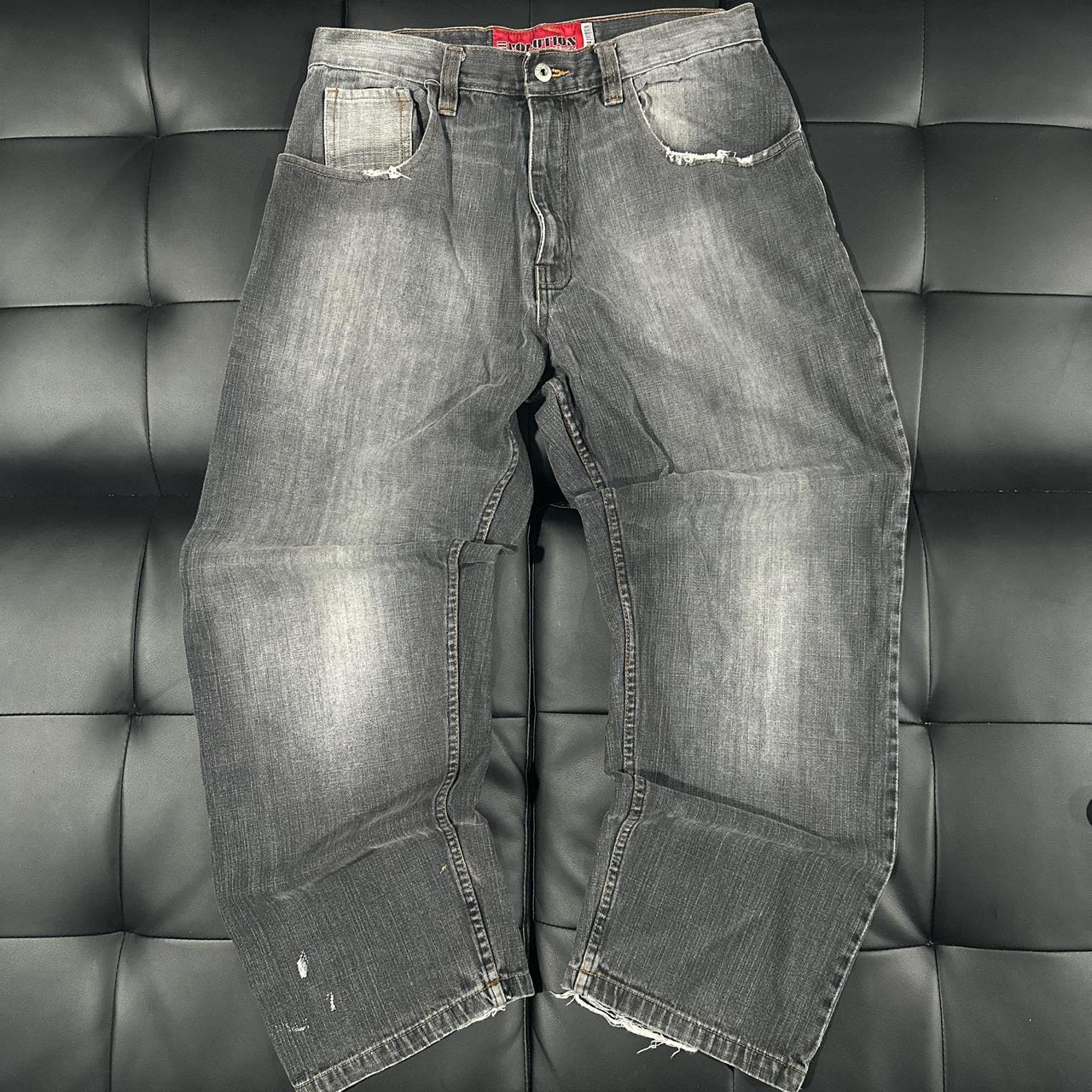 Grey and black Evolution jeans with a baggy fit... - Depop