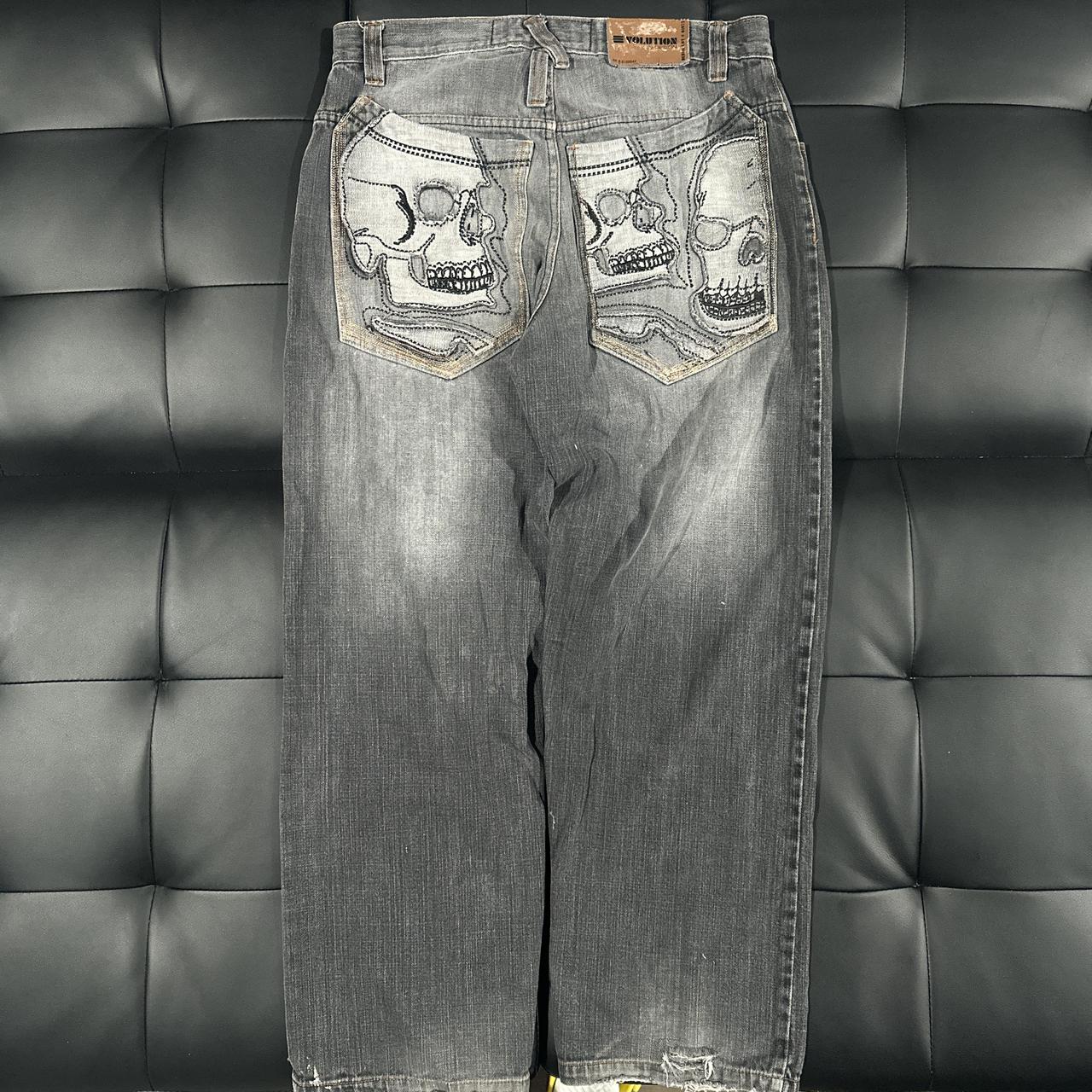 Grey and black Evolution jeans with a baggy fit... - Depop