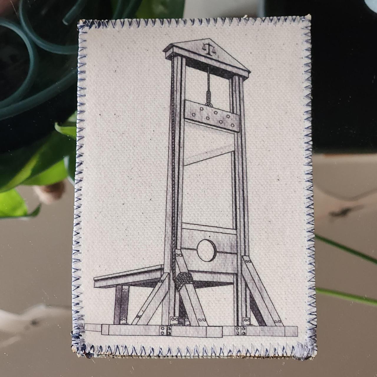 Guillotine Sew-on Patch. Art by PiixelFlux heat... - Depop
