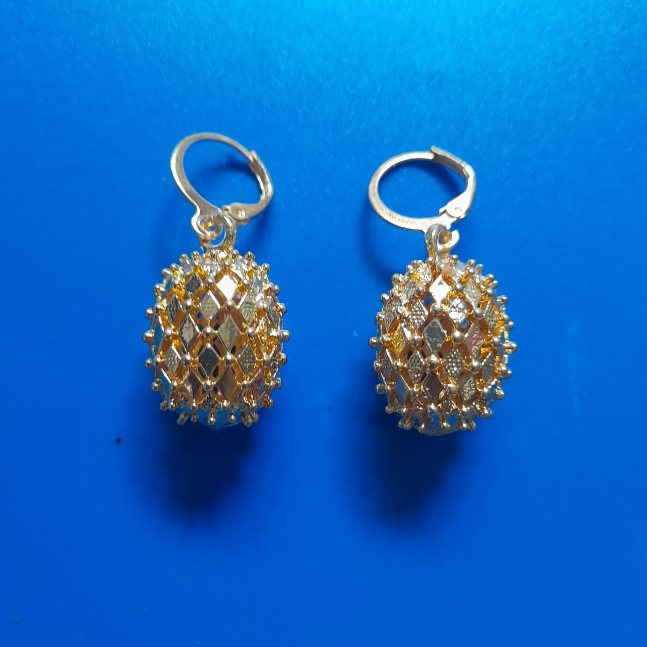 Golden ball design rhombus pattern dangle earrings. - Depop