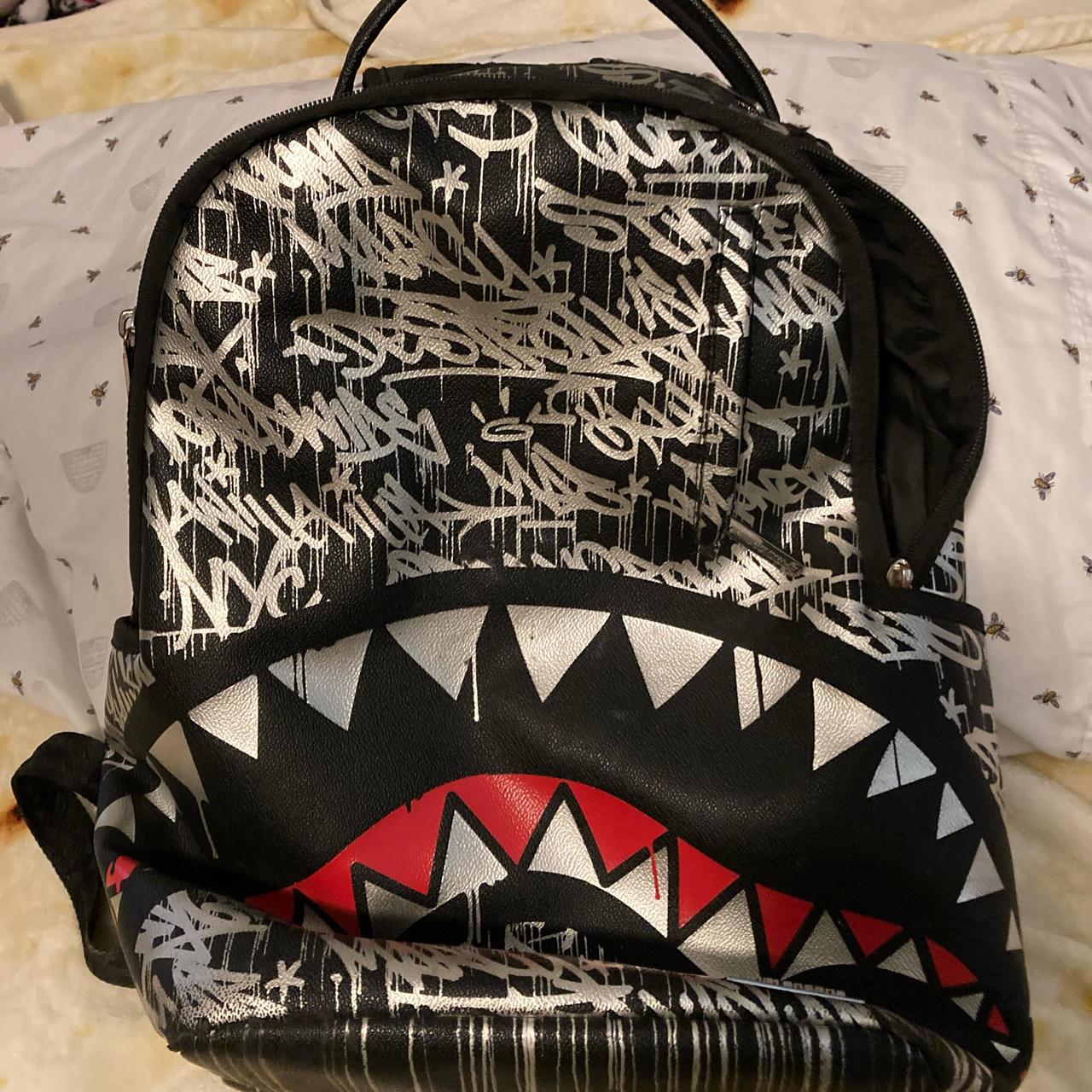 Silver and black Sprayground backpack | Depop