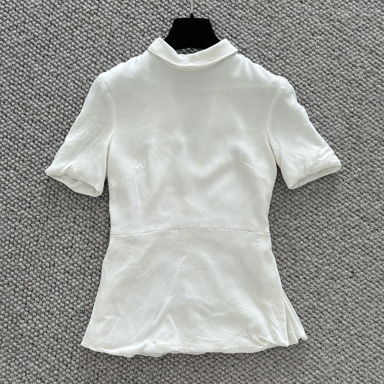 Fully lined white tailored top with side slit... - Depop