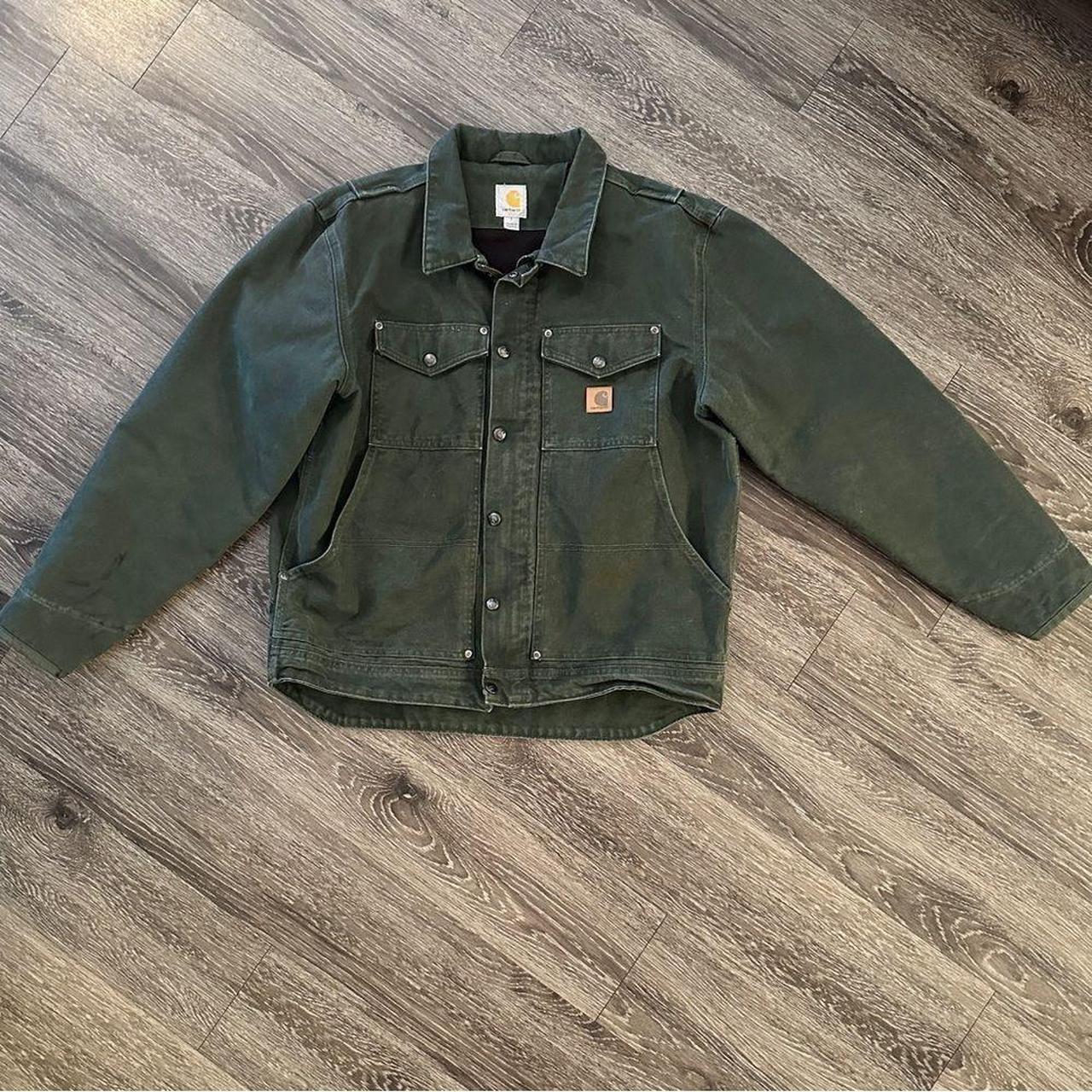 Green Carhartt jacket with a worn, distressed look - Depop