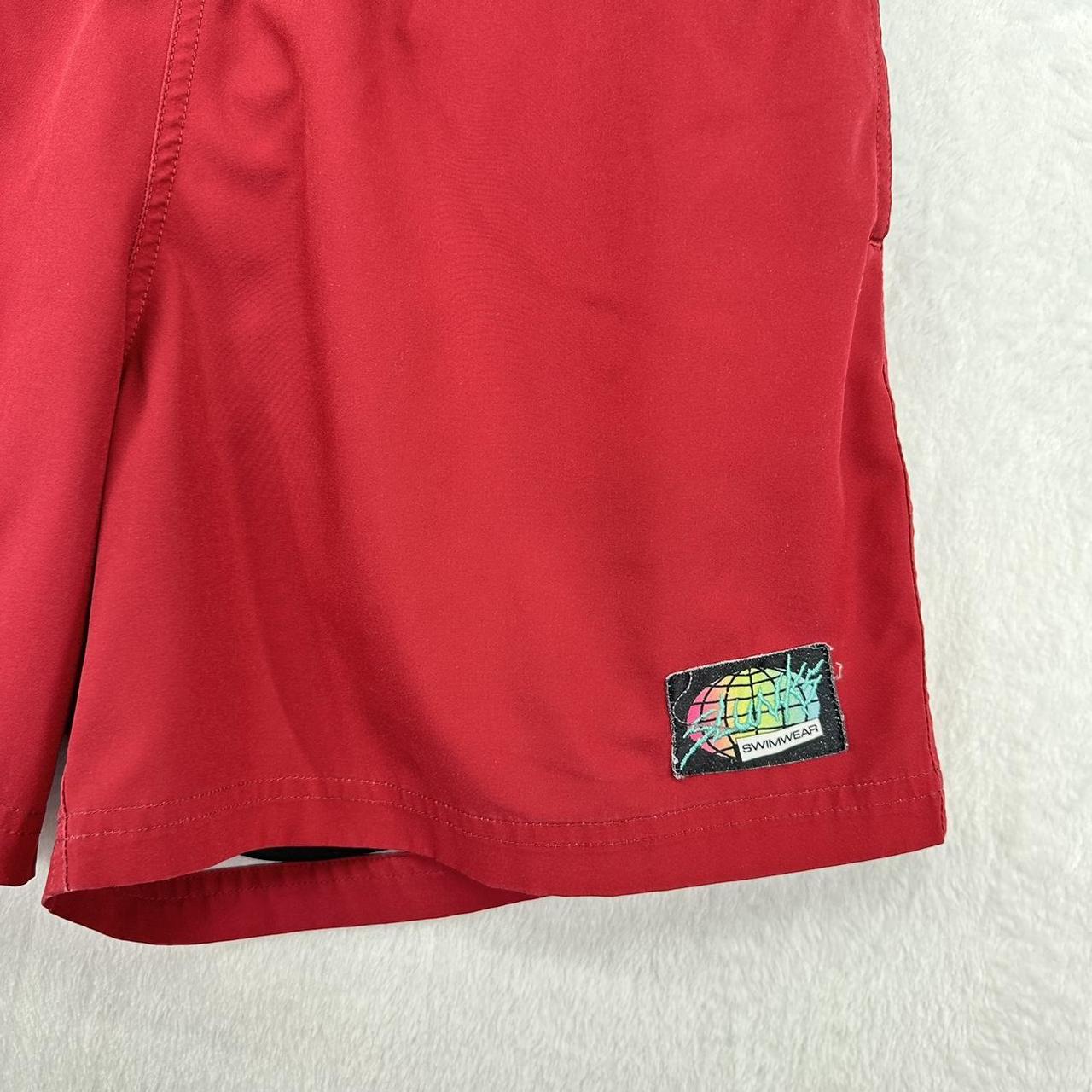 Red and pink slunks swim shorts. Features pockets,... - Depop