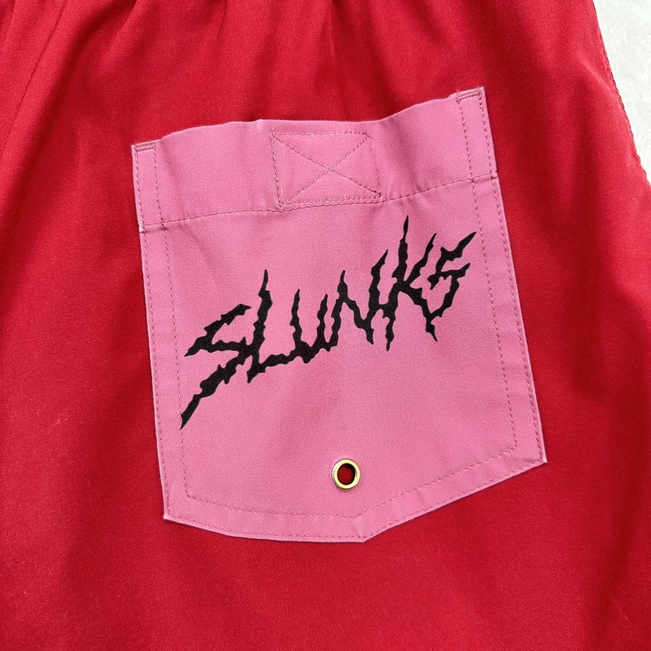 Red and pink slunks swim shorts. Features pockets,... - Depop