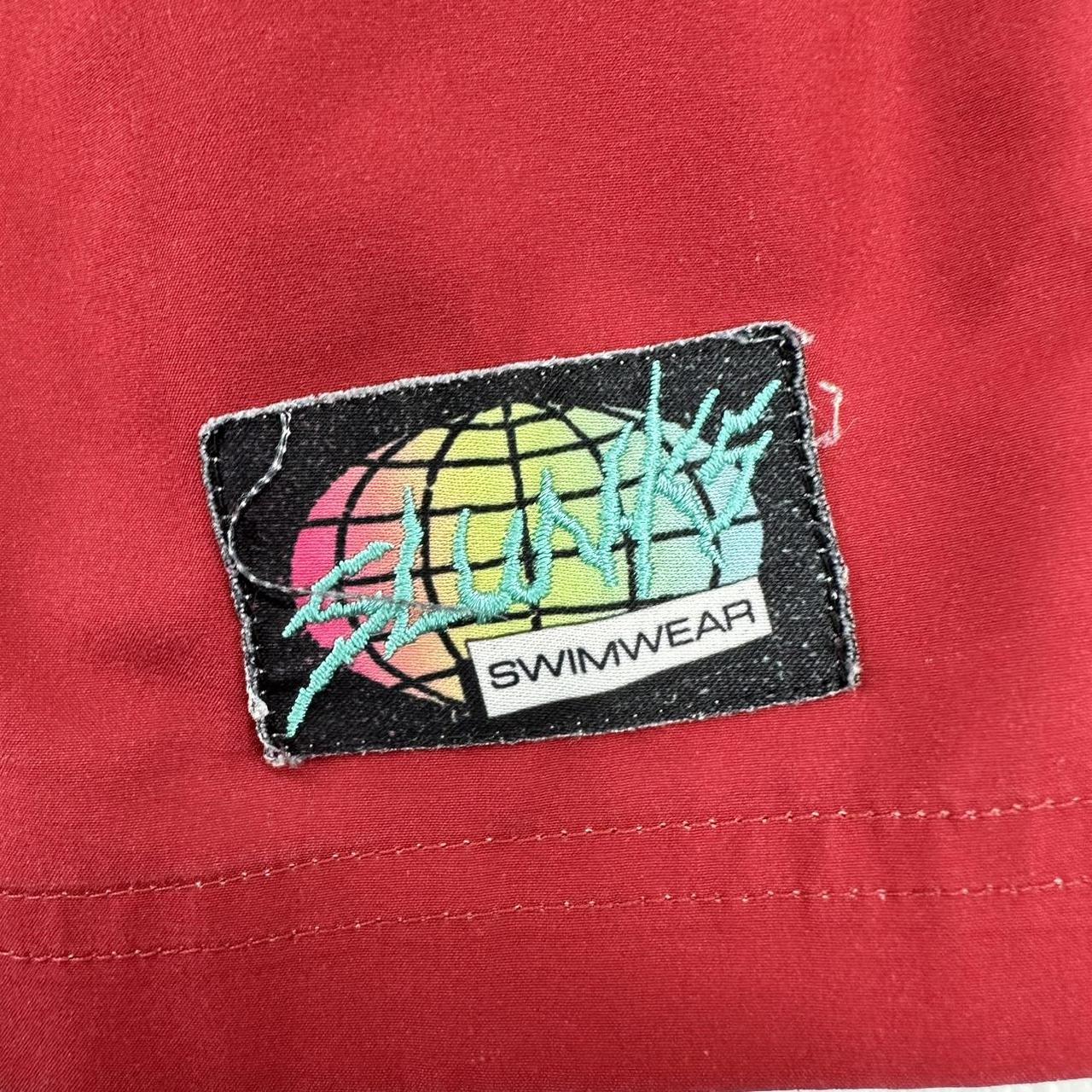 Red and pink slunks swim shorts. Features pockets,... - Depop