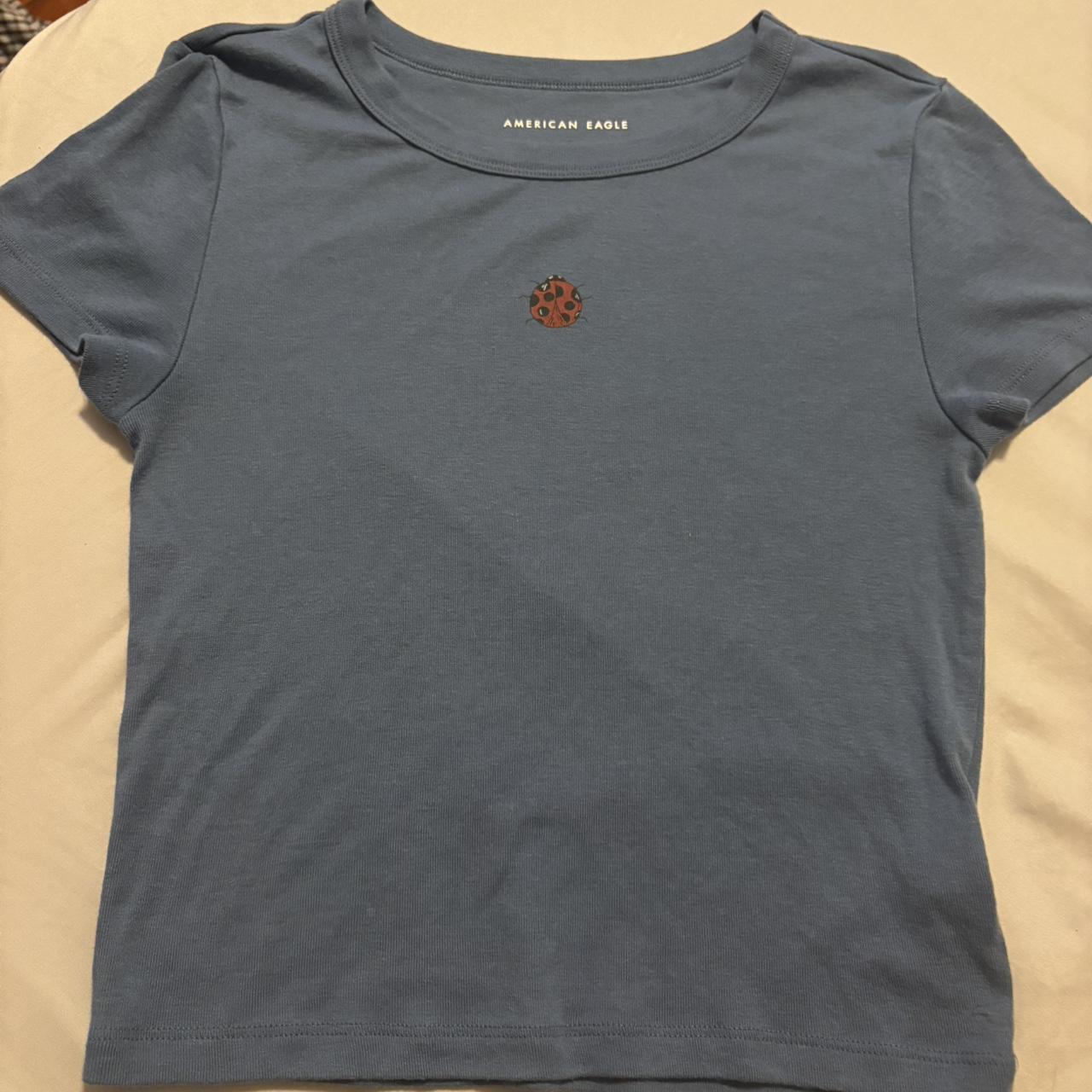 Light blue American Eagle baby tee with ladybug on... | Depop