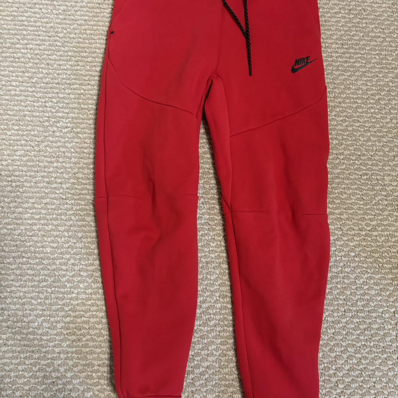 Red Nike tech joggers Amazing condition xs... - Depop