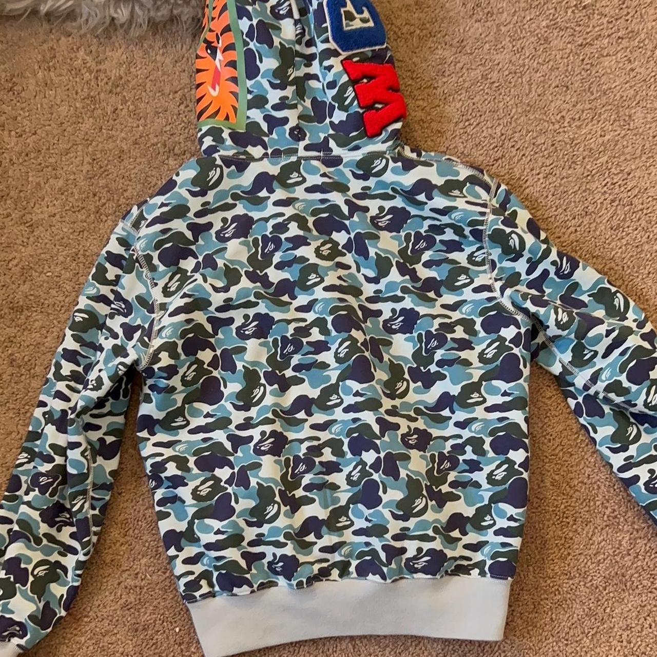 Elevate your style with this iconic blue Bape hoodie... - Depop