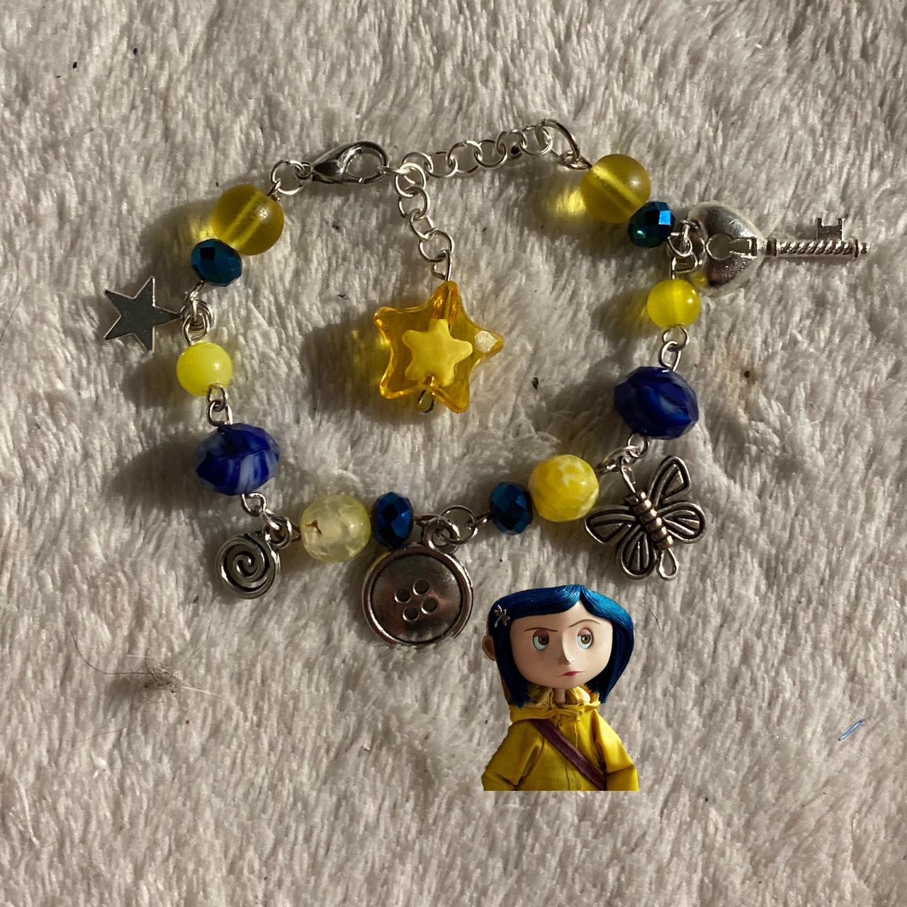 coraline themed charm bracelet