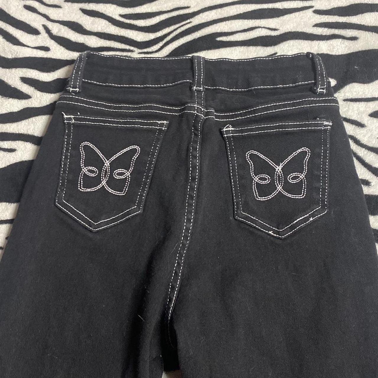 flared black butterfly jeans - Depop