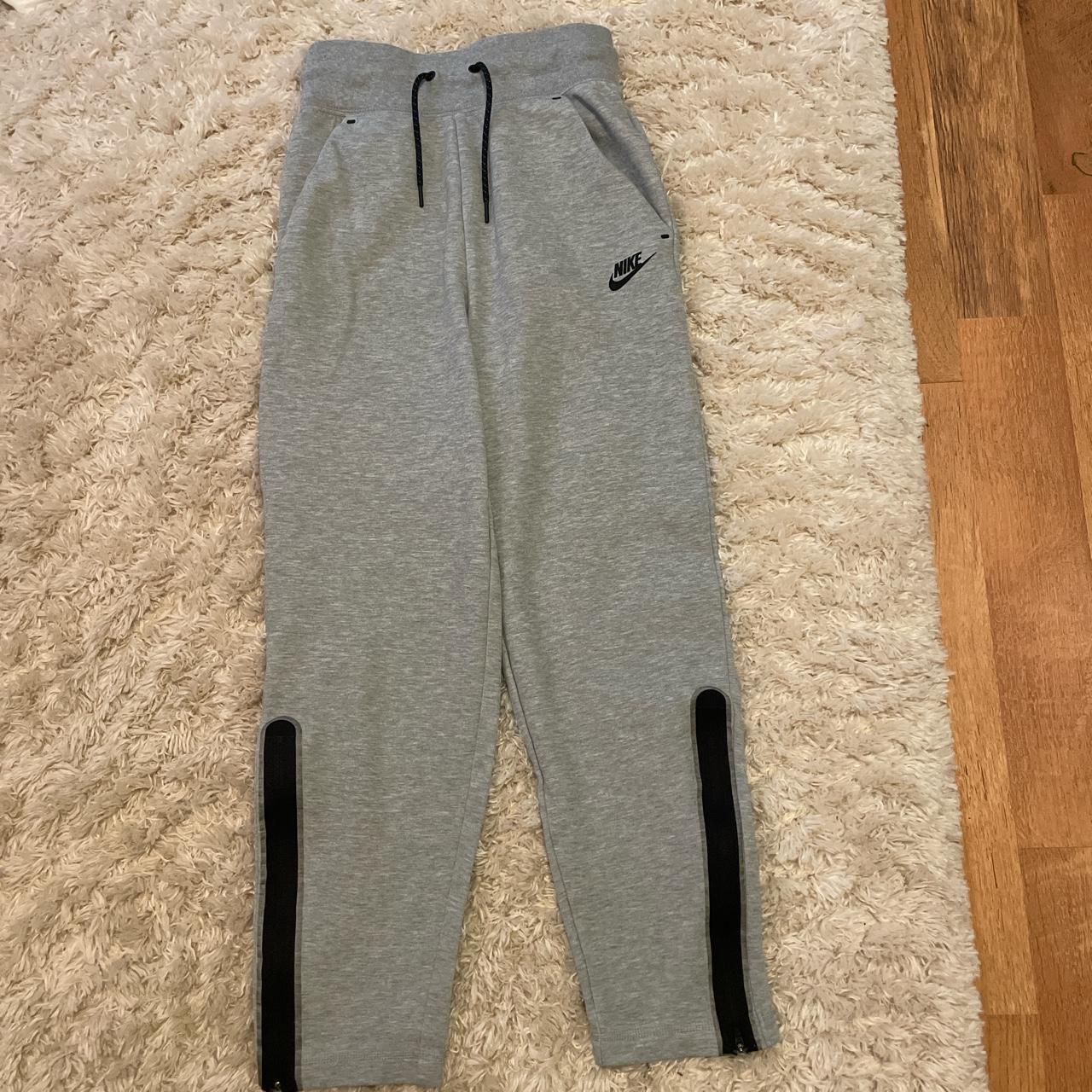 Light grey Nike Tech pants, size XS but long,... - Depop