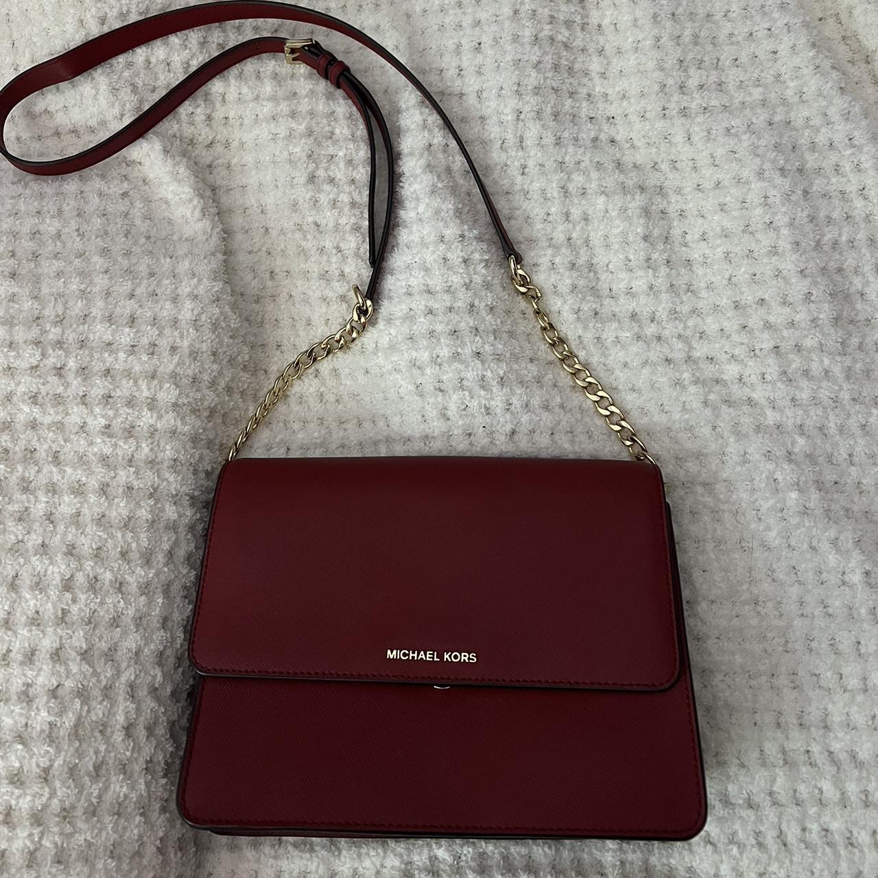 Red micheal kors cross body bag! Has lots of pockets... - Depop