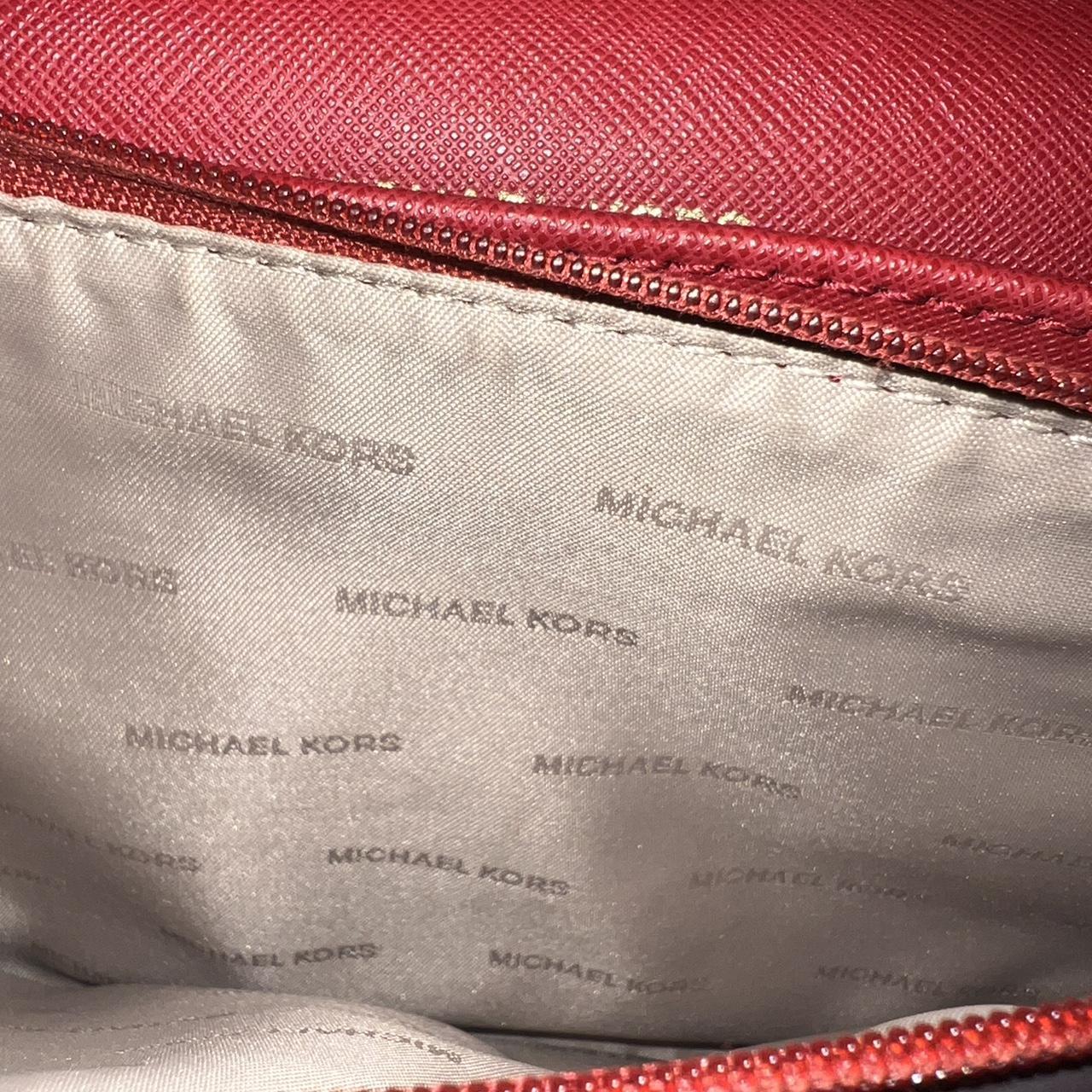 Red micheal kors cross body bag! Has lots of pockets... - Depop